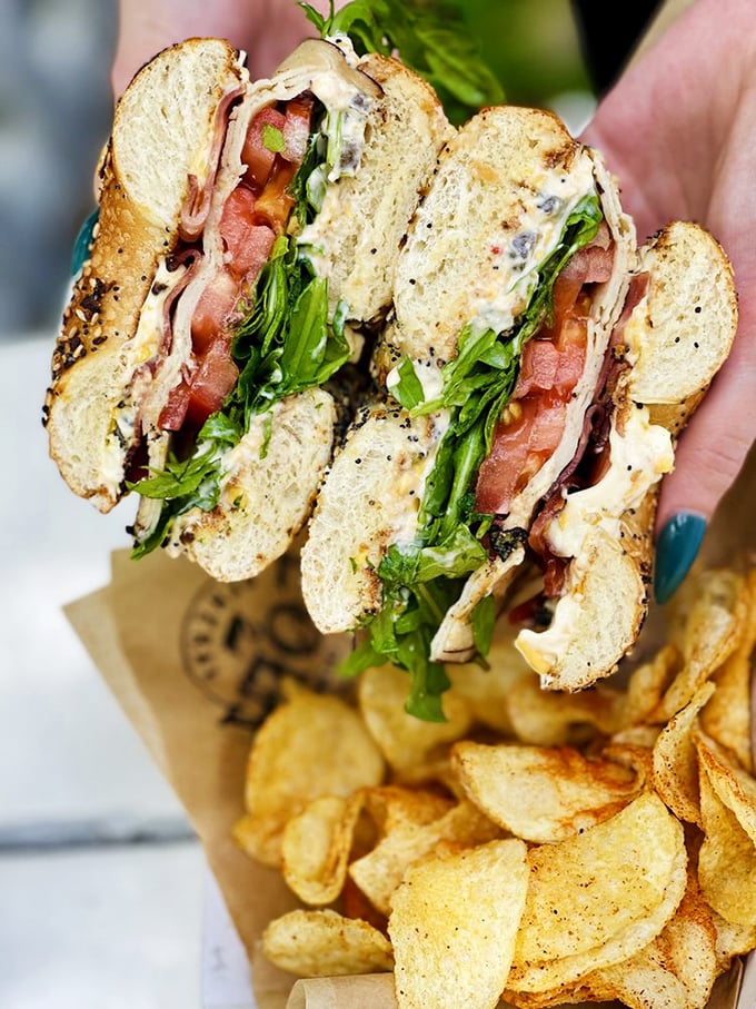 Architecture in sandwich form&mdash;layers of house-roasted turkey, crispy bacon, and fresh veggies create a skyscraper of flavor worth every bite.