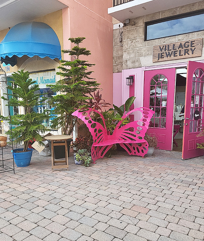 Village Jewelry's eye-catching pink butterfly chair invites shoppers to pause before exploring treasures that sparkle inside.