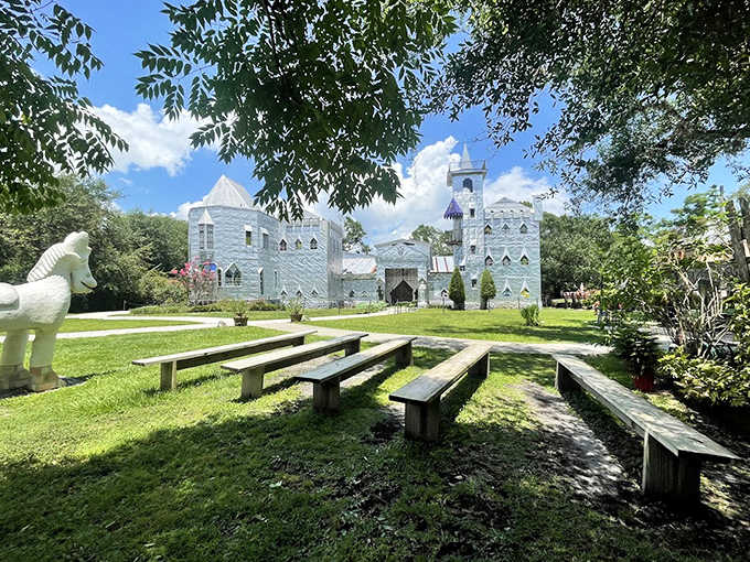 Wooden benches await storytellers and daydreamers alike, perfectly positioned for castle-gazing in this whimsical outdoor theater setting.