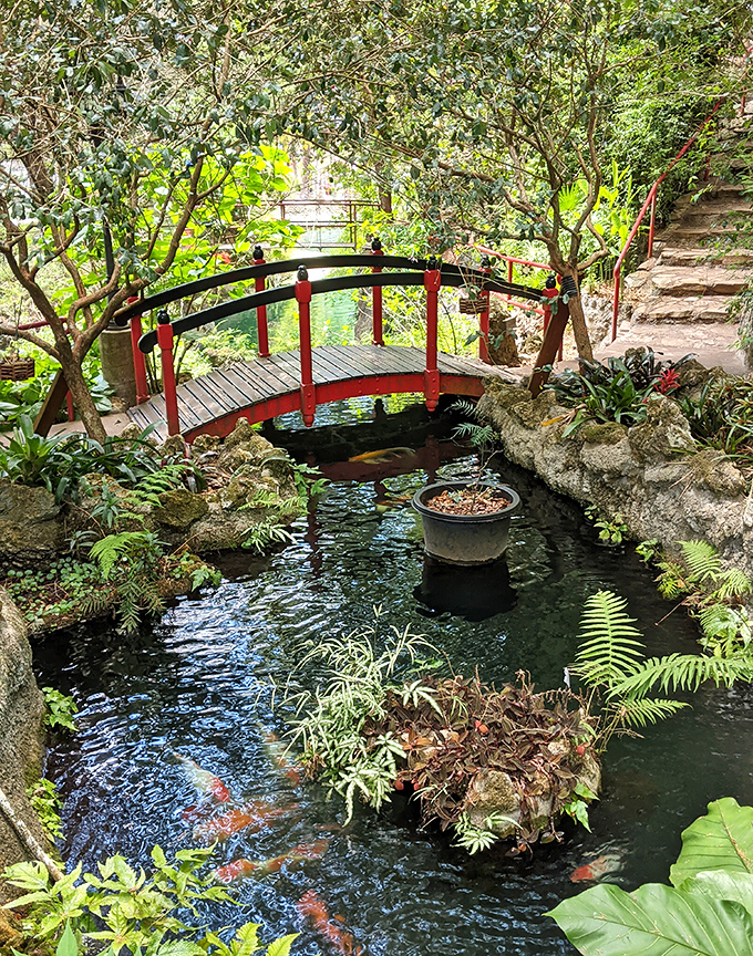 This charming red bridge isn't just crossing water &ndash; it's connecting visitors to the Japanese-inspired tranquility that defines this hidden gem.