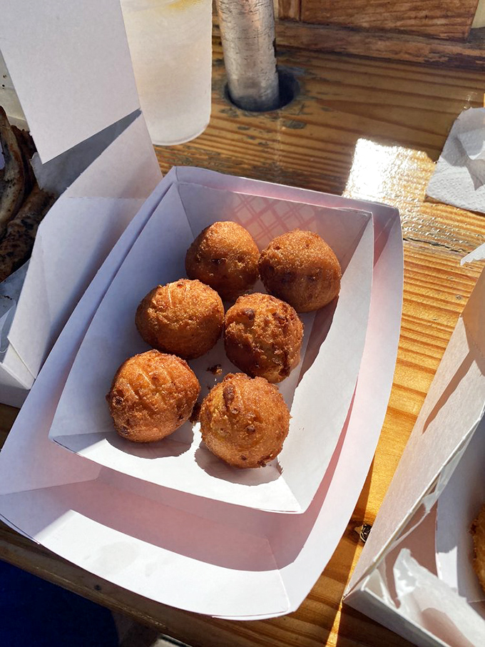 These hush puppies aren't just sides&mdash;they're golden orbs of cornmeal joy that would make any Southern grandmother nod in approval.