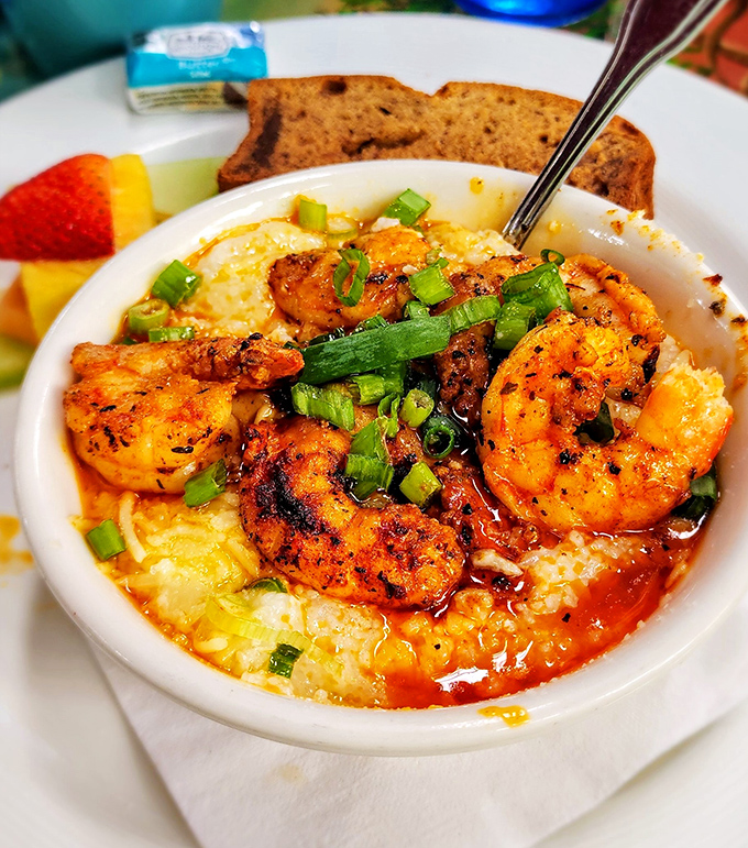 Seafood lovers rejoice! These spicy shrimp over creamy grits might just change your life.