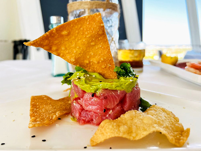 Tuna tartare elevated to art form &ndash; ruby-red tuna stacked with creamy avocado and crisp wonton chips that snap satisfyingly between courses.