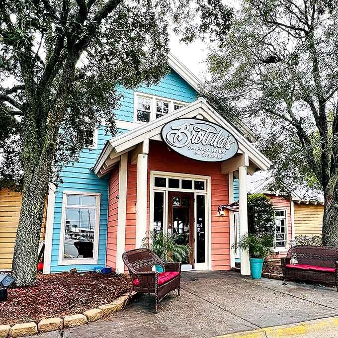Brotula's coral-pink exterior houses one of Destin's most beloved seafood experiences, where coastal elegance meets fresh-off-the-boat flavors.