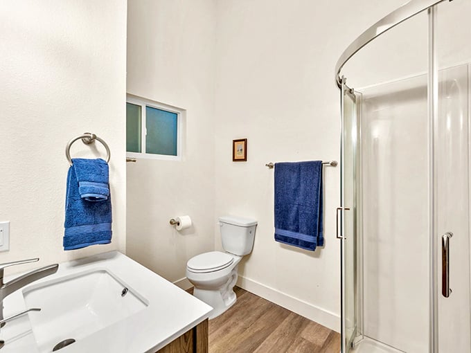 Modern bathrooms with walk-in showers provide a refreshing retreat after a day of beach adventures and island exploration.