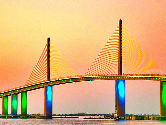 As evening falls, the Skyway transforms into a light show, its illuminated spans creating a magical gateway between earth and sky.