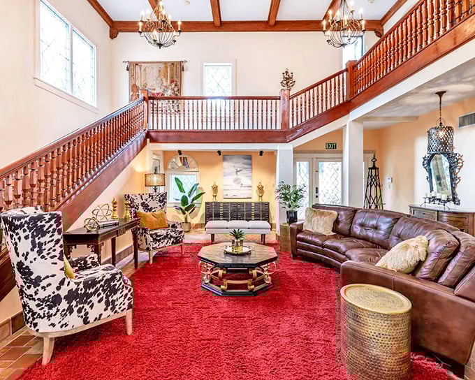 Looking down from the gallery, the castle's interior reveals its impressive scale, with rich wood details warming the expansive space.