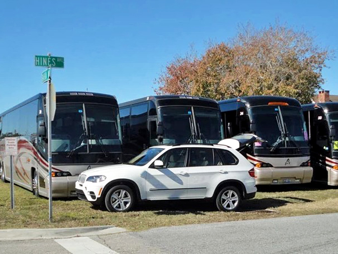 The "Amish Navy" arrives: Pioneer Trails buses deliver northern visitors to their tropical winter haven, creating joyful reunion scenes.