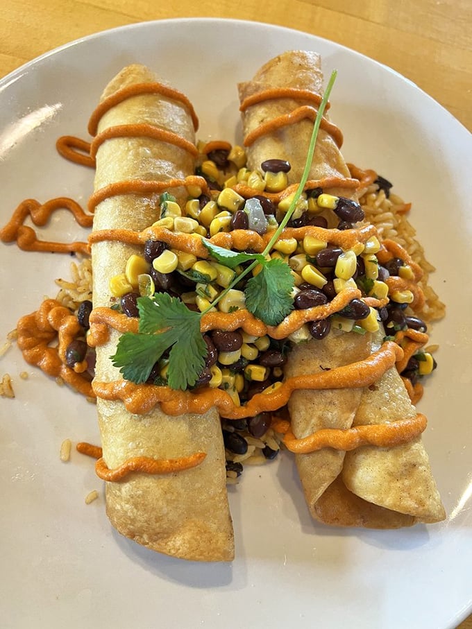 Vegan flautas showcase Norwood's commitment to inclusive dining, with plant-based fillings wrapped in crispy tortillas and topped with fresh corn and bean salsa.