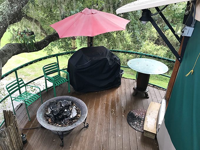 Magic unfolds on this deck where firepit flames could dance under string lights, creating the perfect setting for s'mores and stargazing.