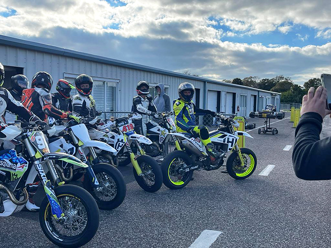 Supermoto riders lined up like modern-day knights, their steeds humming with barely contained power.