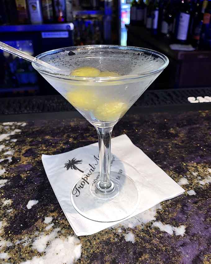 A lemon drop martini glistens in its glass, offering a sweet and tangy start to an evening of indulgence.