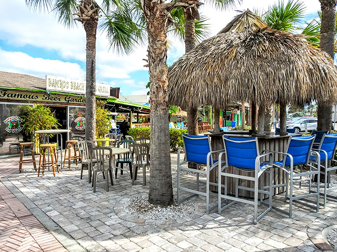 Thatched umbrellas and swaying palms create the perfect tropical backdrop for savoring grouper sandwiches and cold beverages.