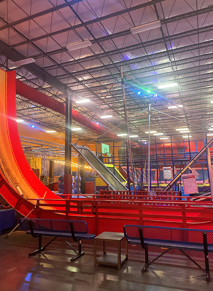 The massive play structure towers overhead like an industrial Candyland – where engineers clearly asked, "But how can we make it MORE fun?"
