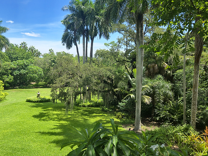The Kampong's lush gardens create a tropical paradise hidden in plain sight, where exotic plants from six continents thrive in harmony.