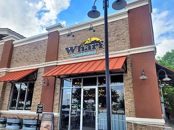 The Wharf's brick exterior and distinctive signage bring a touch of coastal charm to Tallahassee's dining scene.