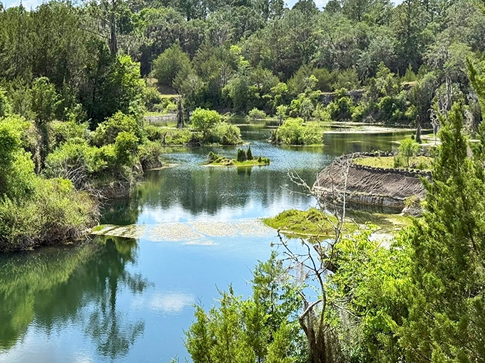 Reflections double the beauty as still waters mirror the surrounding landscape, creating nature's perfect infinity pool among the limestone.