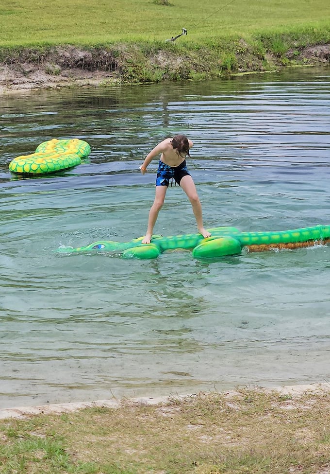 Safe for kids: Childhood summer dreams come alive as youngsters navigate inflatable adventures in waters clear enough to spot every fish.