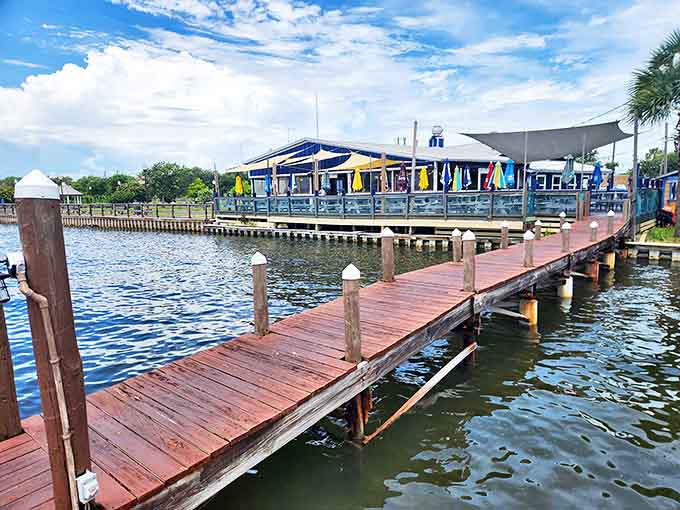 A wooden dock leads to The Shack, where waterfront dining means boats bobbing just feet from your table of fresh seafood.