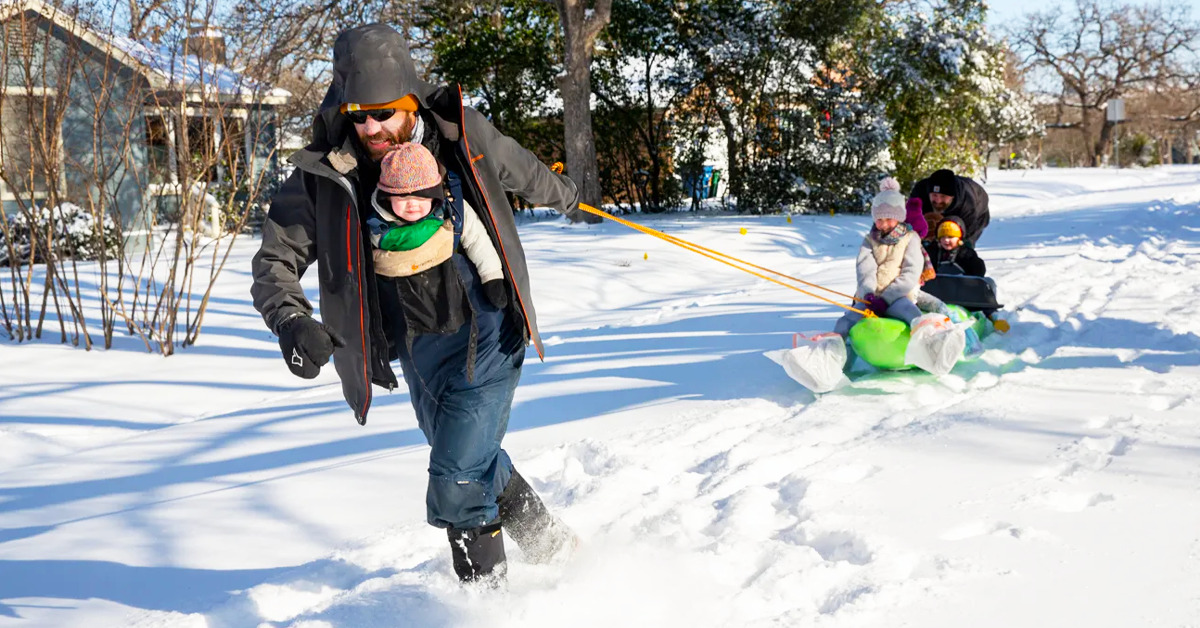 A family playing outside in Austin in winter.