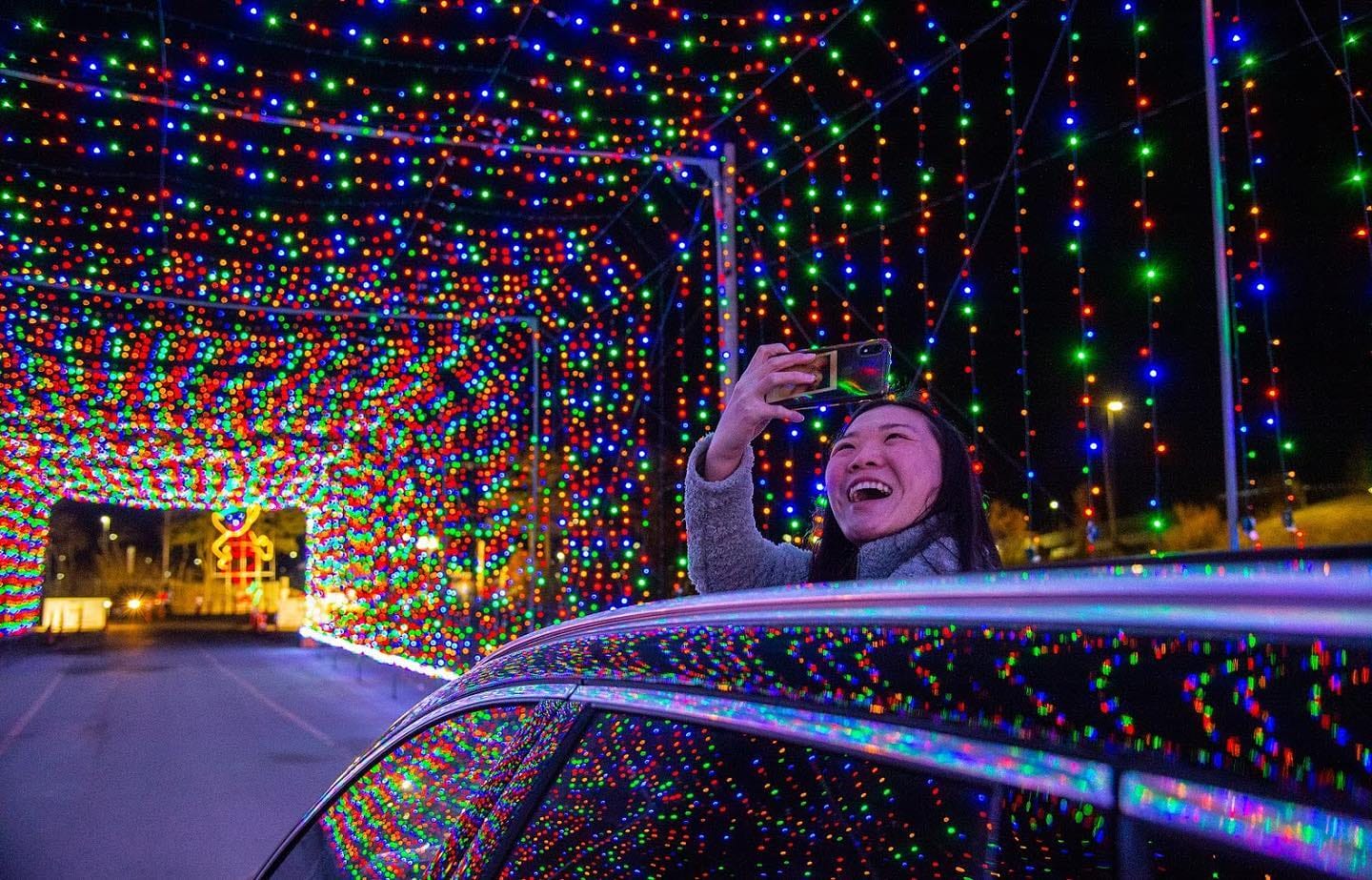 A girl enjoying the view of the mesmerizing lights