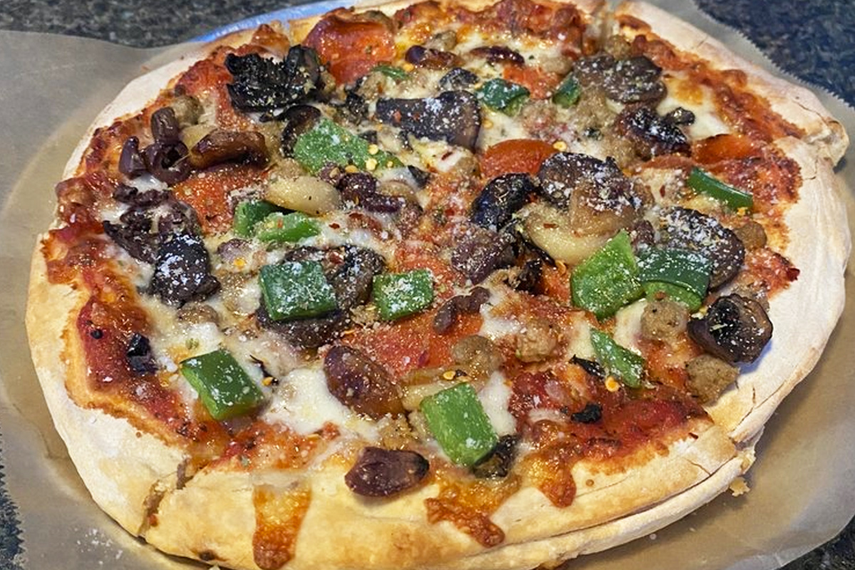 A plate of delicious pizza with various toppings.