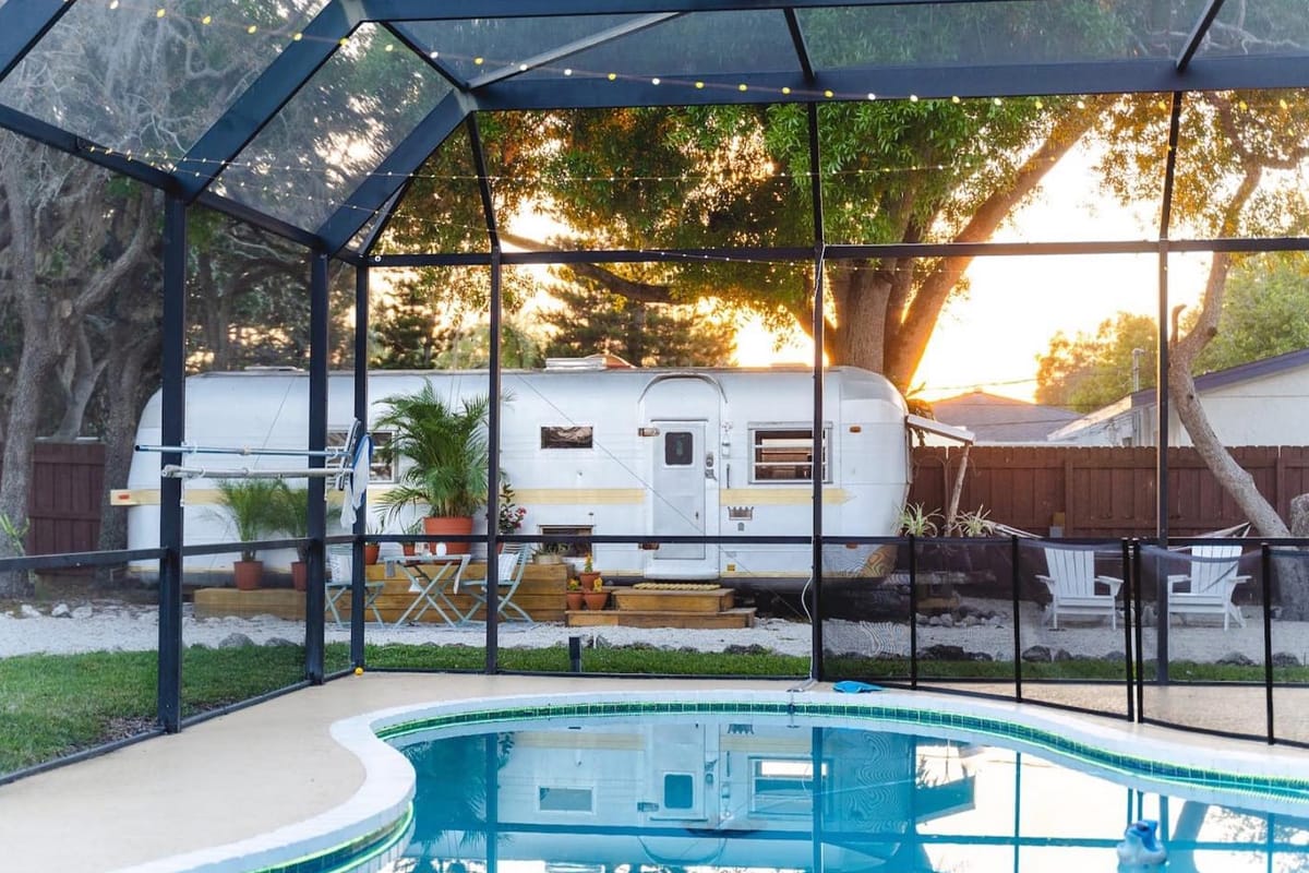 A shot from the shaded pool overlooking the vintage airstream.