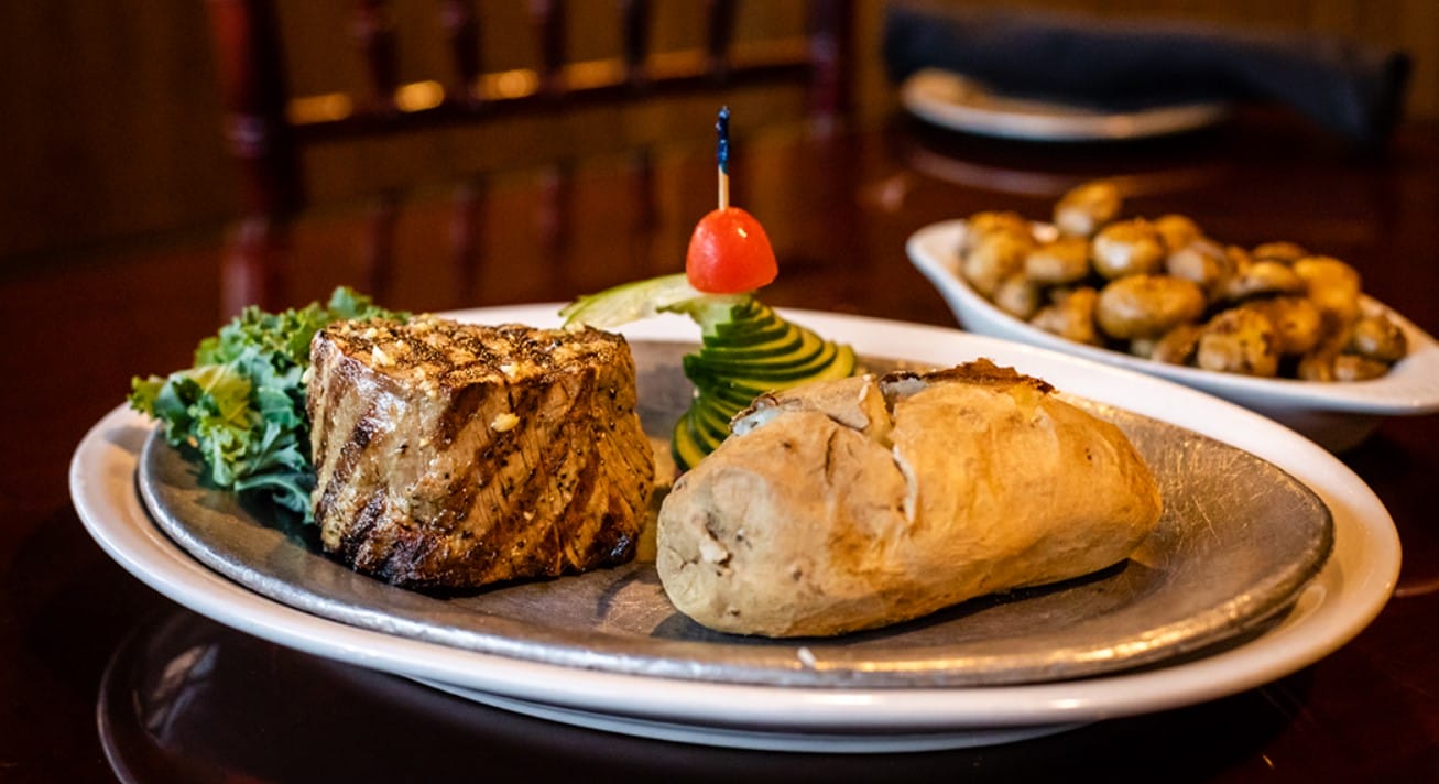 a steak with a bunch of side