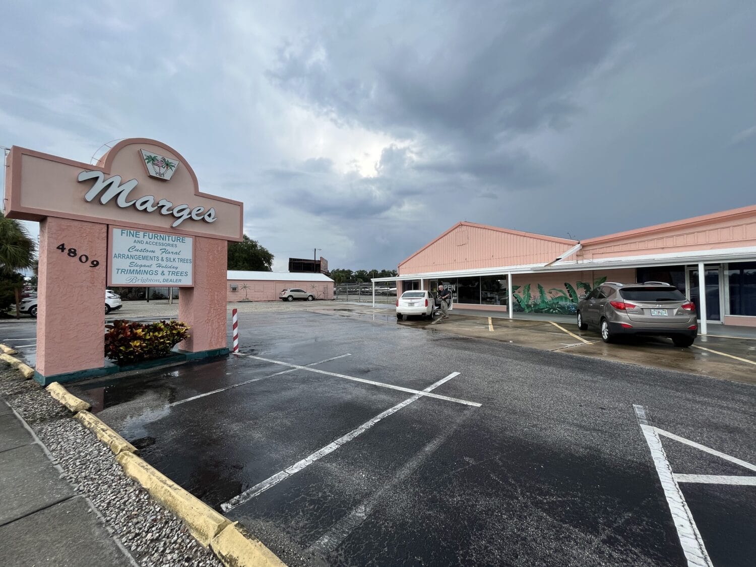 A wide shot of the exterior of marges specialties store.