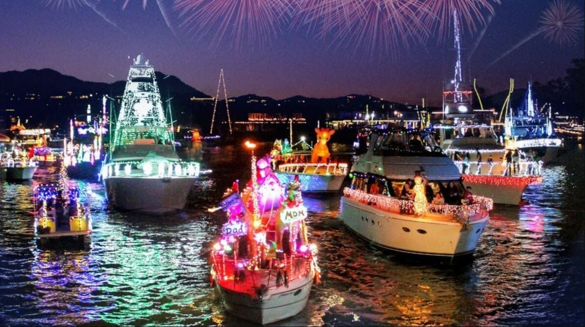 boats adorned in holiday lights