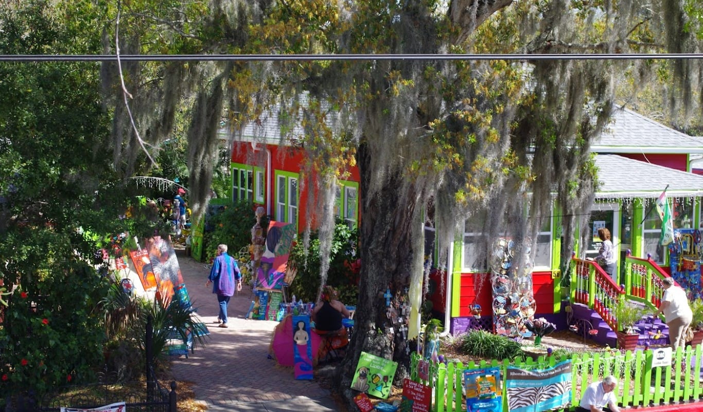 people enjoying the art of the village