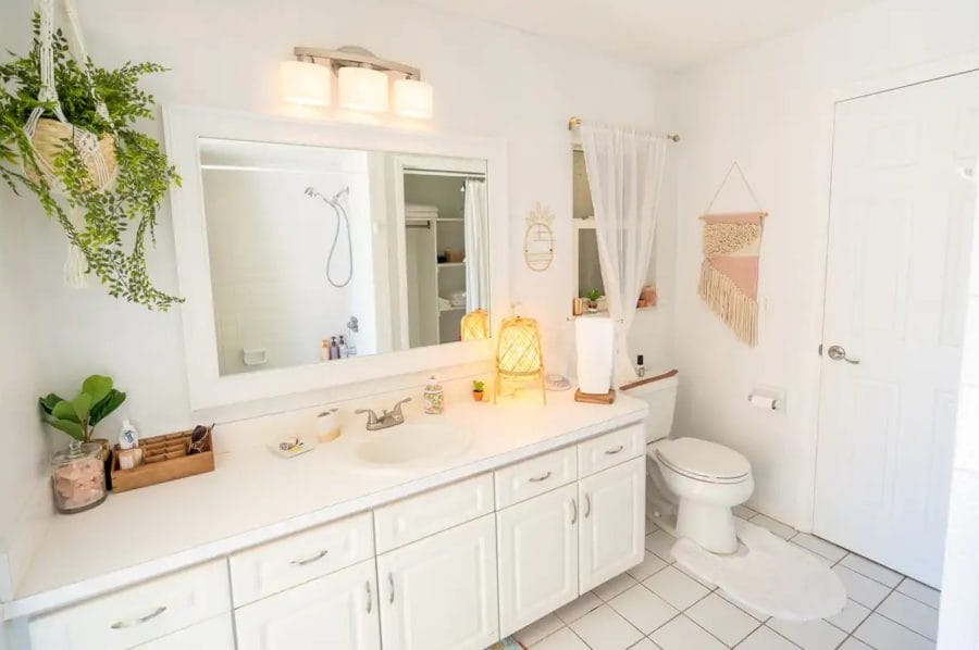 The all-white bohemian style comfort room.