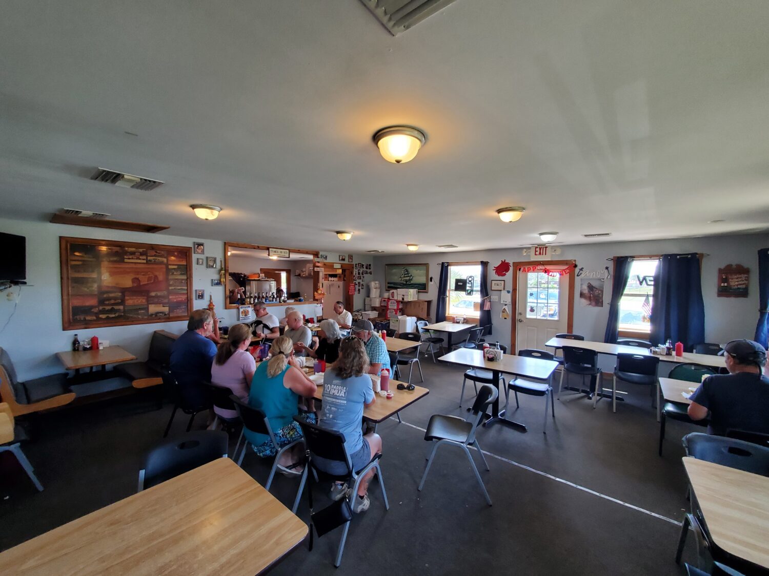The interior of the restaurants with people enjoying their meal