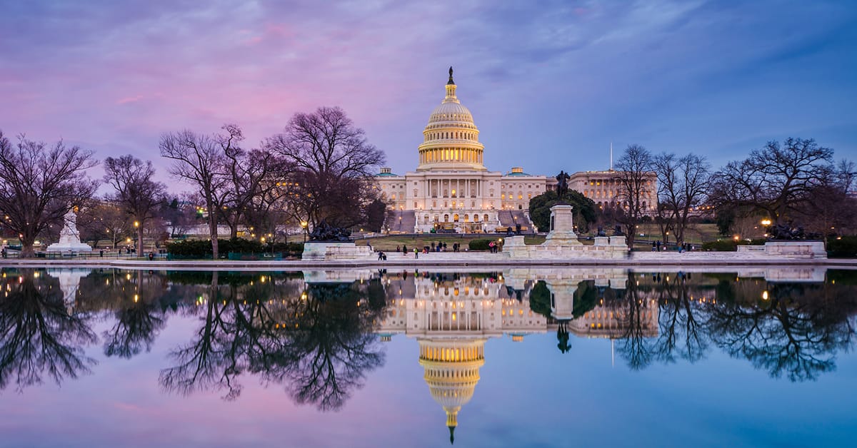 An image of the United States Capitol Building in winter.