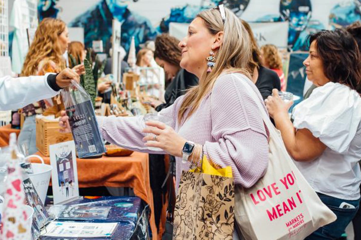 people buying at the holiday market