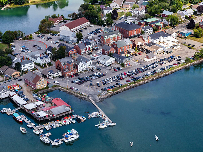 Damariscotta from above &ndash; where water meets history in a perfect Maine embrace. The harbor's gentle curve cradles boats like precious gems.