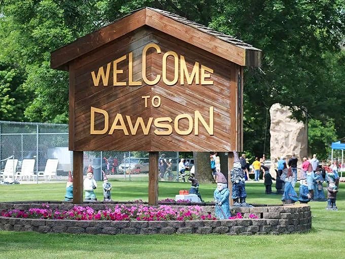Dawson welcomes visitors with its charming wooden sign surrounded by the town's famous gnome residents &ndash; your first clue this isn't your average small town.