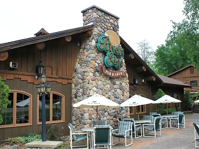 The rustic stone and timber exterior of Rivers Edge welcomes hungry travelers with a promise of northwoods charm and unexpected aquatic surprises.