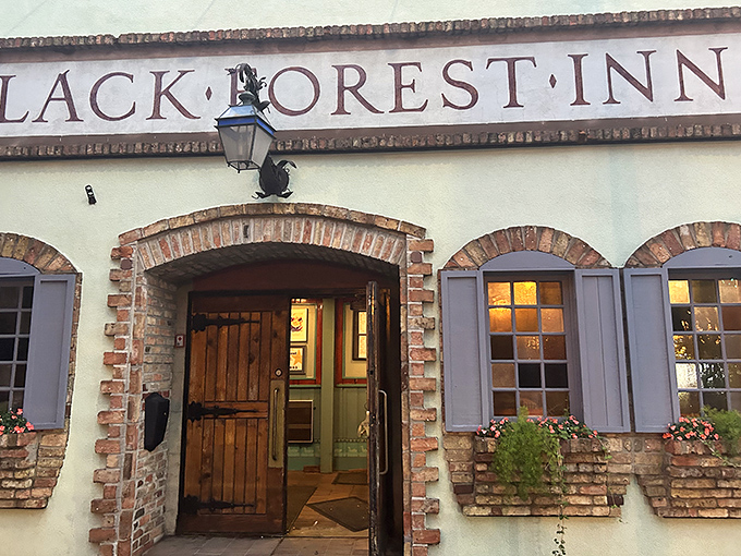 The iconic facade of Black Forest Inn beckons with old-world charm, its brick-trimmed entrance promising authentic Bavarian delights within. Like finding Europe on a Minneapolis street corner!