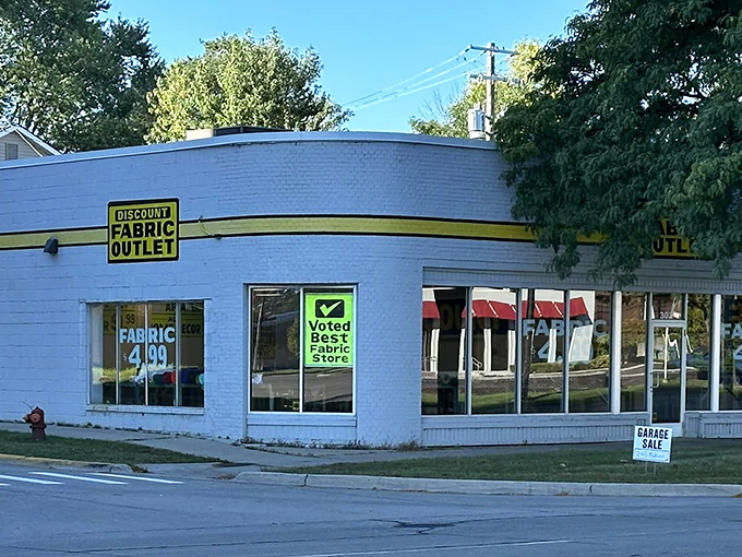 The unassuming exterior of Discount Fabric Outlet belies the textile wonderland waiting inside, where creativity meets affordability on every shelf.