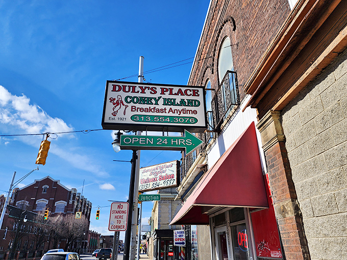 The iconic Duly's Place sign beckons hungry Detroiters 24/7, a neon-lit promise of comfort food that's survived a century of city changes.