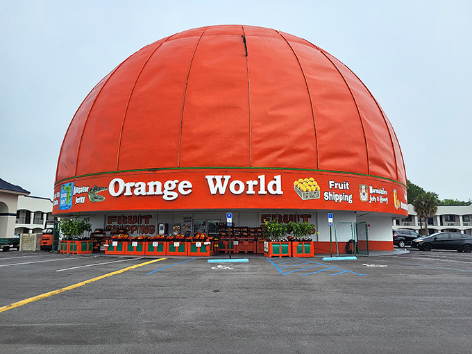 The unmistakable orange dome of Orange World stands like a citrus beacon along the highway, promising fruity treasures within.