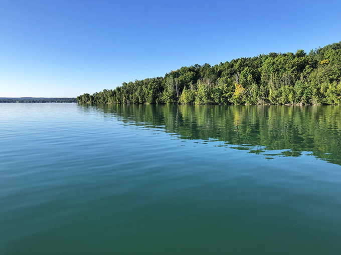 Nature's masterpiece: Elk Lake's crystal waters mirror the sky, creating a double dose of Michigan magic.