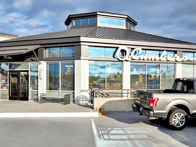 The distinctive hexagonal-topped building of Q. Cumbers stands like a beacon for hungry souls on France Avenue, promising culinary adventures within.