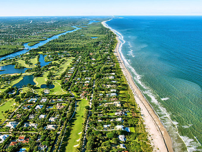A breathtaking aerial view where the Atlantic kisses the shoreline &ndash; Mother Nature showing off her favorite Florida canvas.