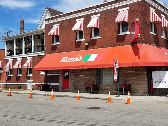 The iconic red awnings and classic brick facade of Amore da Roma stand as a beacon of Italian culinary tradition in Detroit's Eastern Market district.