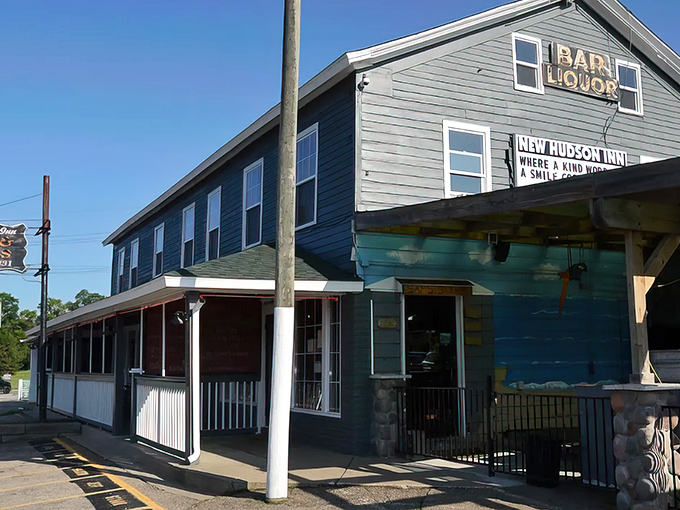 The historic New Hudson Inn stands proudly since 1831, its weathered blue exterior hiding burger treasures that would make a food detective swoon.