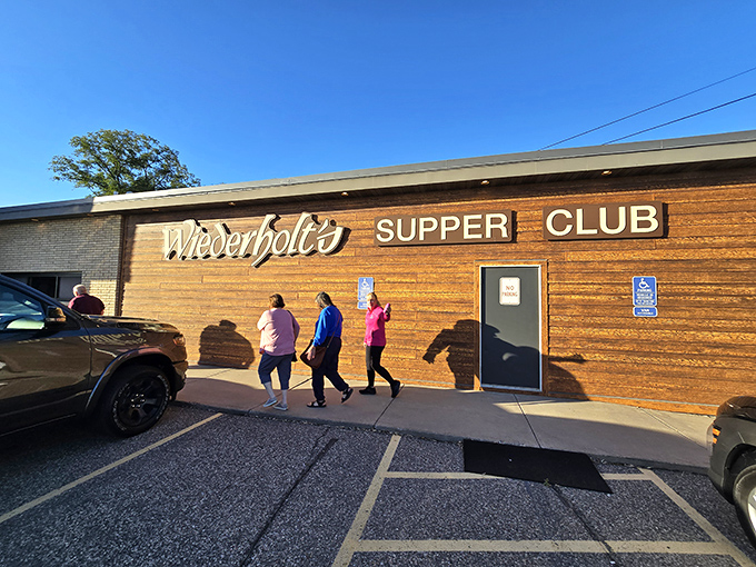 The wooden facade of Wiederholt's Supper Club stands proudly in Hastings, a time capsule of Midwestern dining tradition waiting to be discovered.