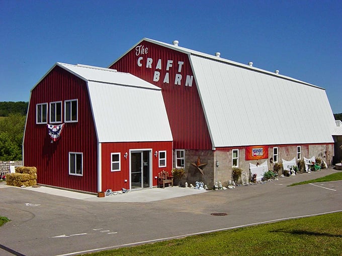 Classic red barn architecture meets retail therapy heaven – The Craft Barn's exterior promises treasures within those weathered walls.