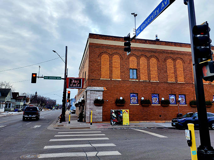 The iconic brick exterior of Jax Cafe stands proudly at the corner of University Avenue, a culinary landmark that's been welcoming hungry Minnesotans since 1933.